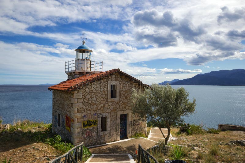 Abandoned Stone Lighthouse Under a Dramatic Sky, Greece. Stock Photo ...