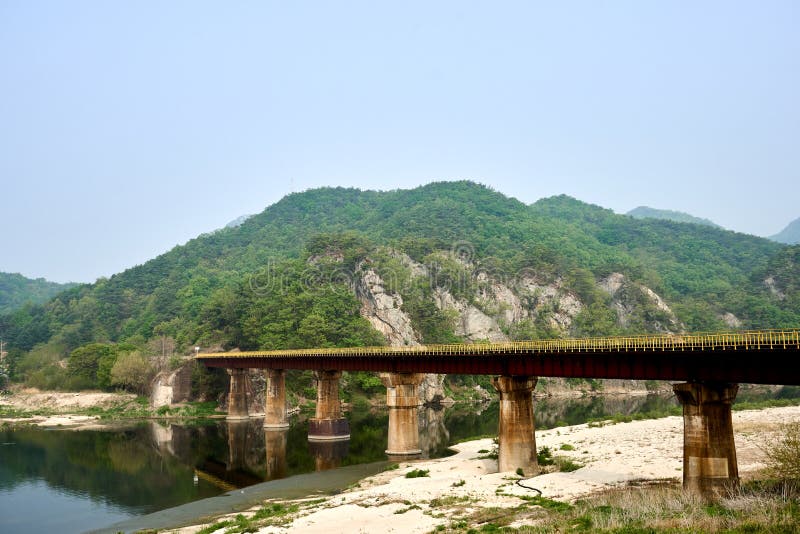 View of an Old Railroad Bridge and Its Reflection upon the Seom River ...