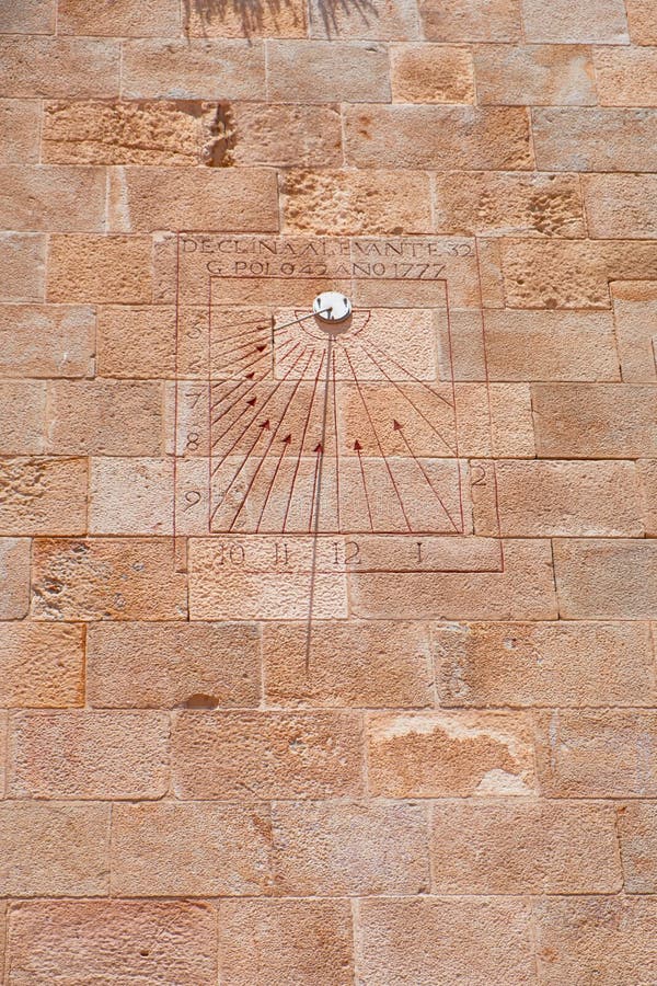 View of an Old Sundial Located on an Ancient Wall. Roman Numbers ...