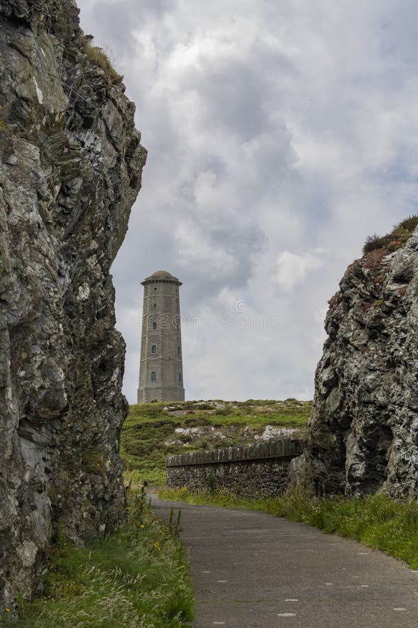 A View of the Old Wicklow Lighthouse through a Gap in the Cliff. Stock ...