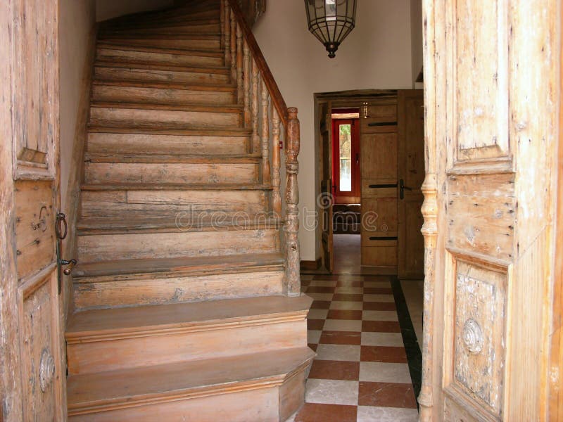 View of an Open Door with a Wooden Staircase Inside the House Stock ...