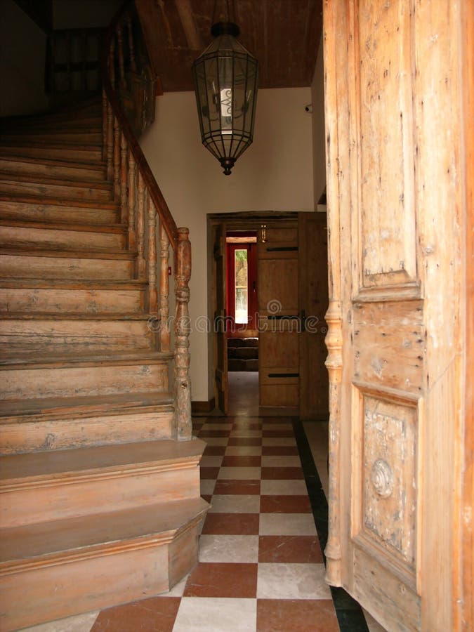 View of an Open Door with a Wooden Staircase Inside the House Stock ...
