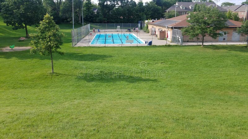 Open public swimming pool stock image. Image of neighborhood - 228516375