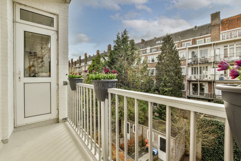 View of Opposite Building from Balcony Stock Photo - Image of sidewalk ...