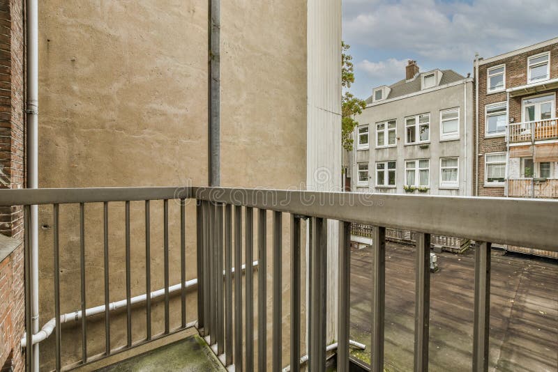 View of Opposite Building from Balcony Stock Image - Image of signs ...