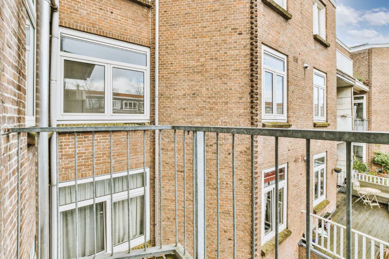 View of Opposite Building from Balcony Stock Photo - Image of white ...