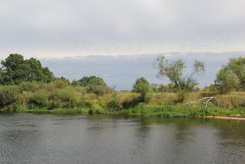 View on the Other Side of the River Stock Image - Image of clouds ...