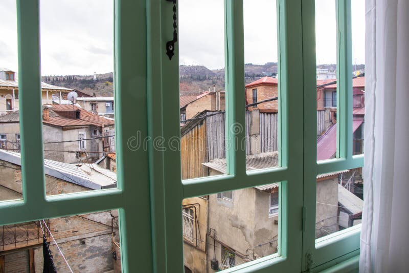 The View from Outside a Window of Some Buildings and a Balcony Stock ...