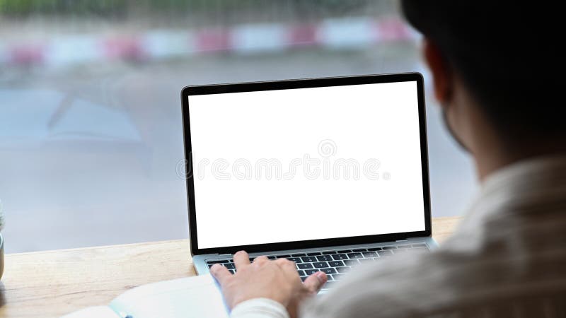 View Over Businessman Shoulder Using Computer Laptop in the Office ...
