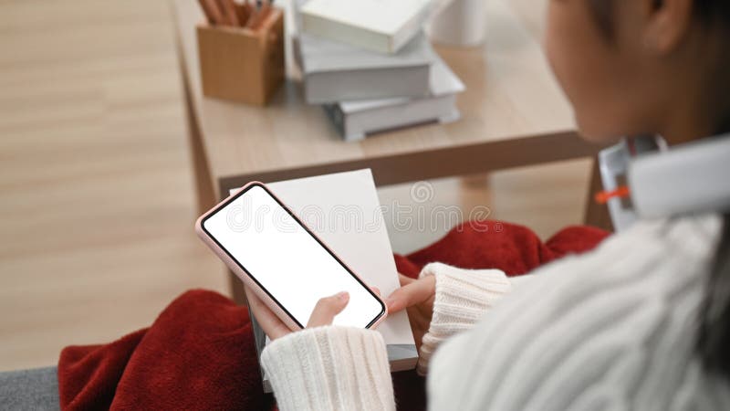 Girl Sitting on Sofa and Using Mobile Phone. Stock Image - Image of ...