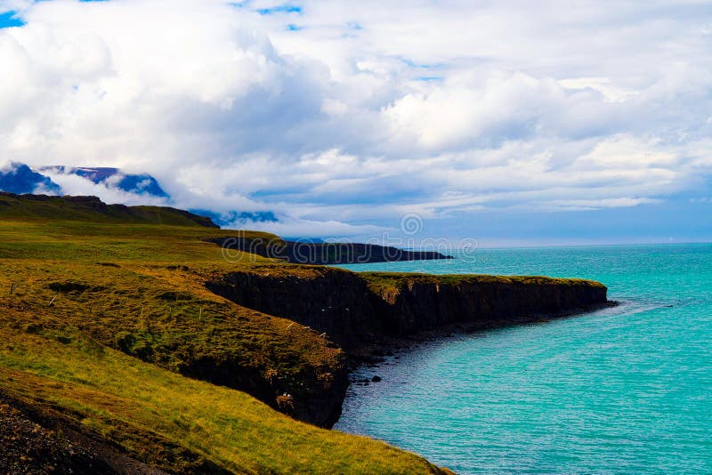 View Over Green Grass on Steep Cliffs of Coast Line Stock Photo - Image ...