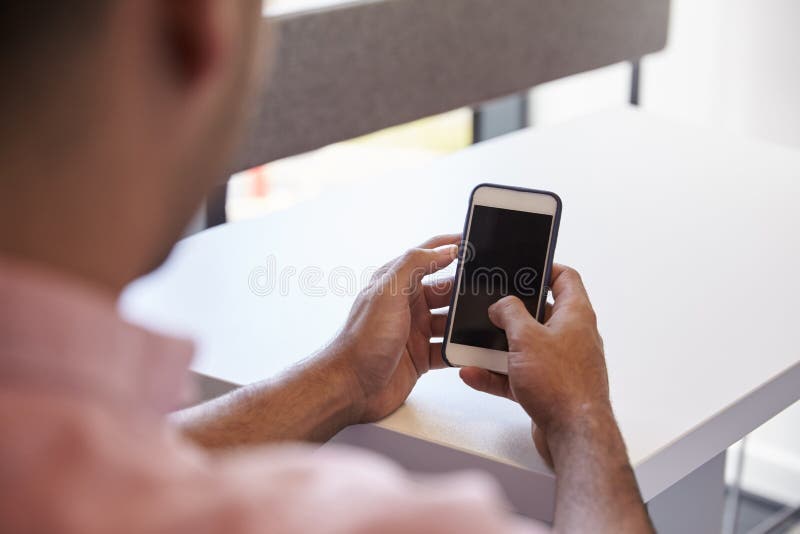 View Over the Shoulder of Male Student Using Mobile Phone Stock Photo ...