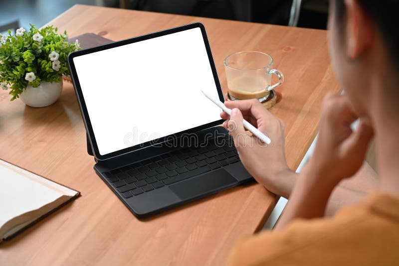 Young Man in Face Mask Talking on Mobile Pone and Using Laptop Computer ...