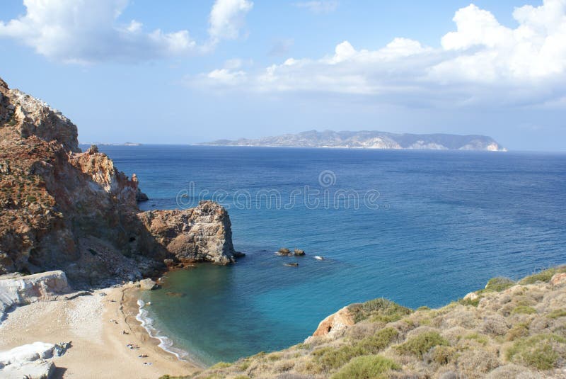 View of Paliorema Beach in Milos, Greece. Poliegos Island in the ...