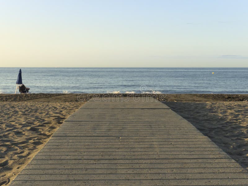 View of a Path To the Sea at Sunrise with only One Person at the Beach ...