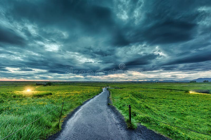 View of Pathway on Agricultural Field and Moody Sky in Summer Stock ...