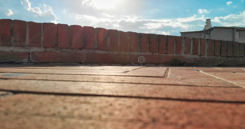 View of Pavement and Small Wall from the Ground Stock Photo - Image of ...