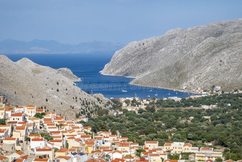 View of Pedi Harbor and Village Below from Symi Castle in Greece Stock ...