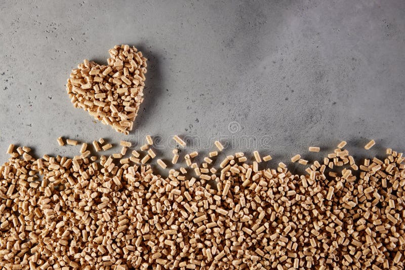 View of Pile of Solid Fuel Pellets Scattered on Gray Background and ...