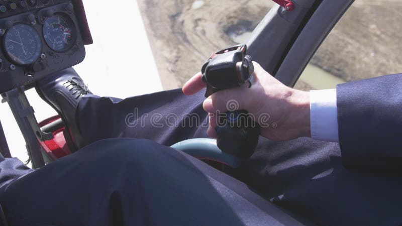 View at Pilot Take Control Handle To Take Off on Helicopter. Camera ...