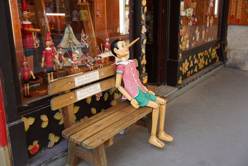 View of Pinocchio Sitting on a Wooden Bench in a Shop Editorial Stock ...