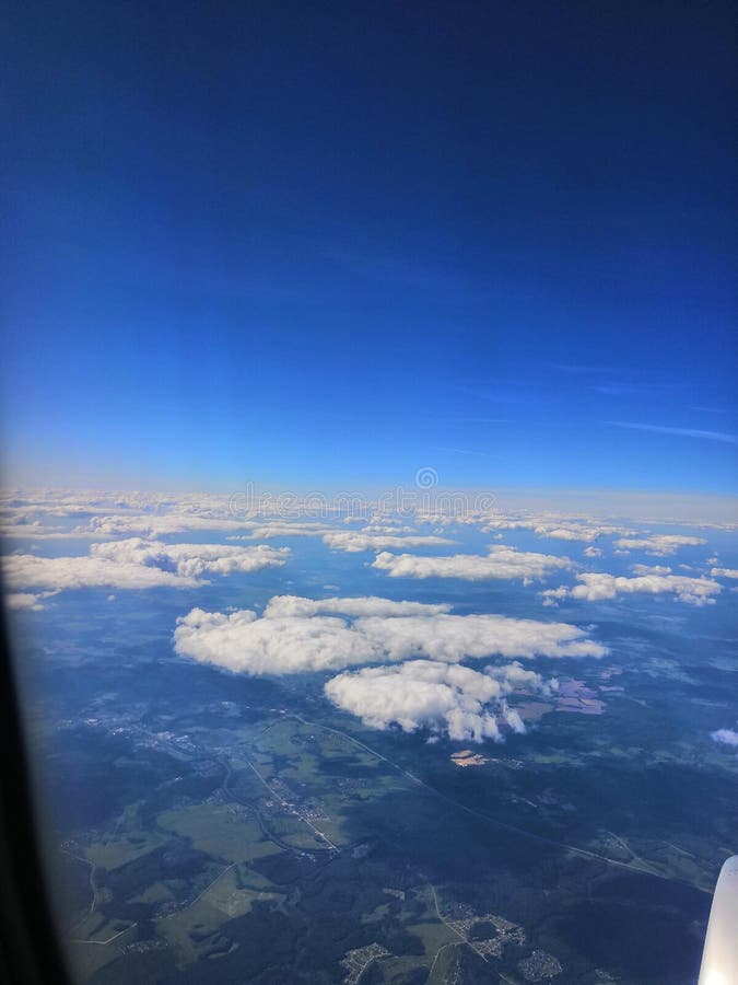 View from the Plane Window, Turquoise Blue Clouds and Sky during the ...