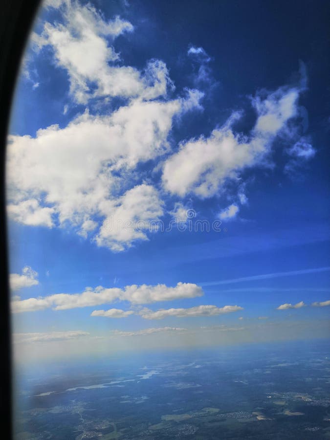 View from the Plane Window, Turquoise Blue Clouds and Sky during the ...