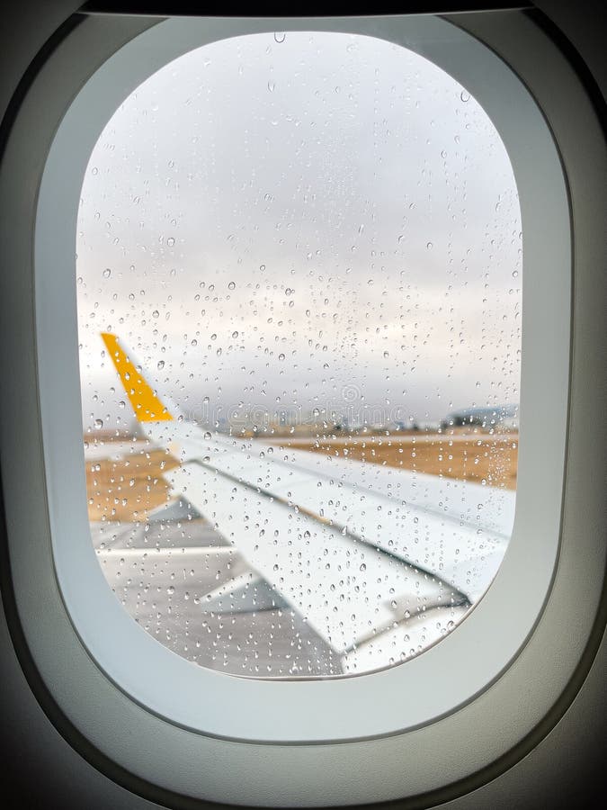 View from a Plane Window during a Winter Storm Stock Image - Image of ...