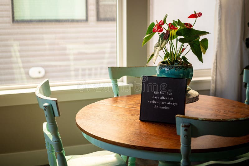 View of a Plant and Quotation Board Over the Kitchen Table by the ...