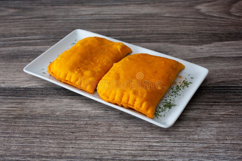 Plate of Jamaican patties stock photo. Image of board - 280273746