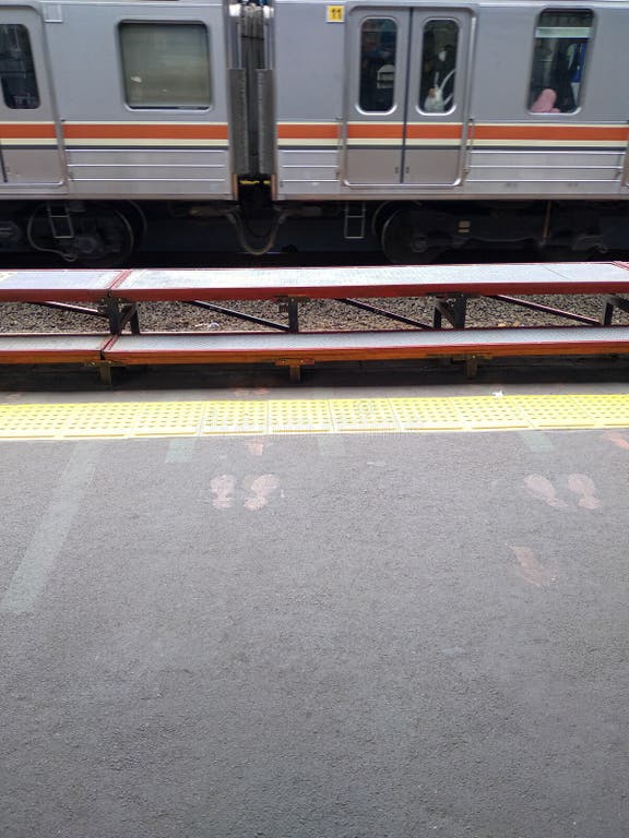 View of the Platform of the Commuter Line Train Station with Running ...