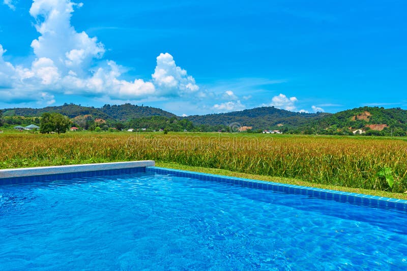 The View from the Pool To the Field and Mountains. Swimming Pool in an ...