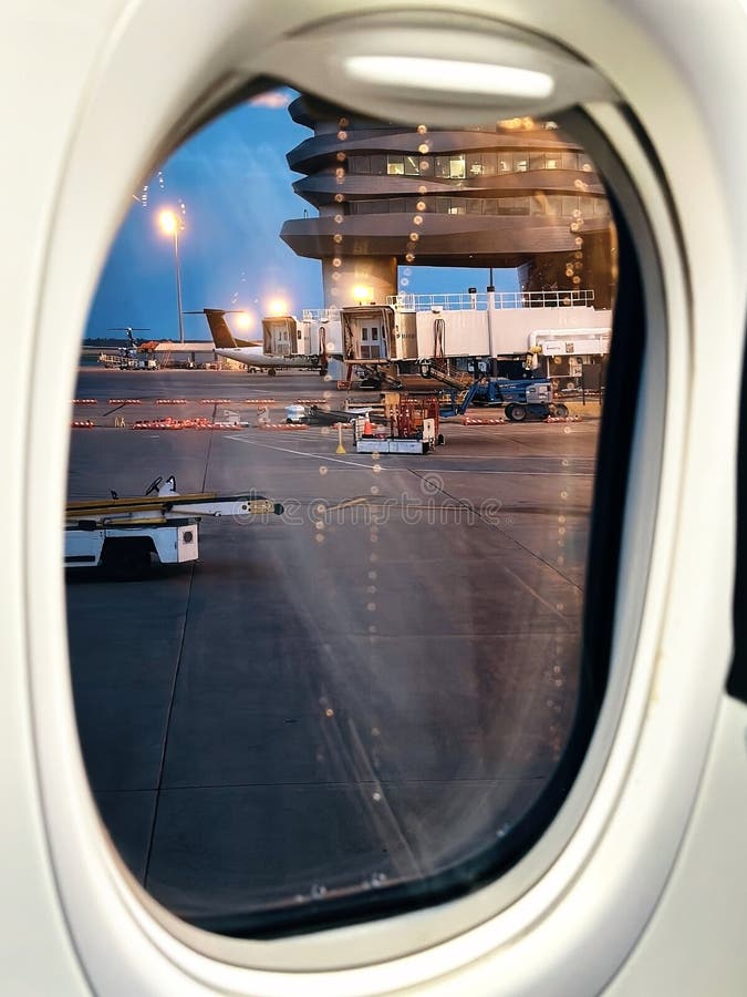 View from the Porthole of Plane on the Runway of the Airport Editorial ...