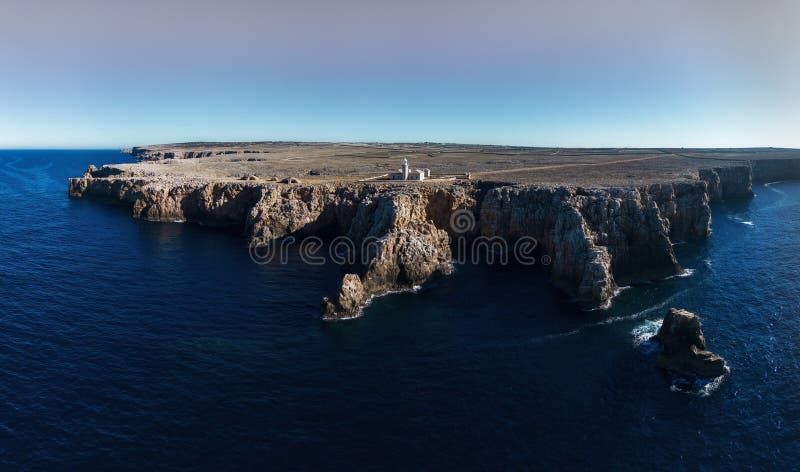 View of the Punta Nati Lighthouse and Coastal Cliffs in Northwestern ...