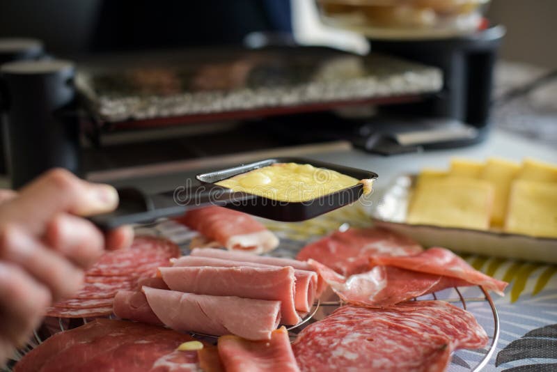 View of a Raclette Dish at Home Stock Photo - Image of sausage, table ...