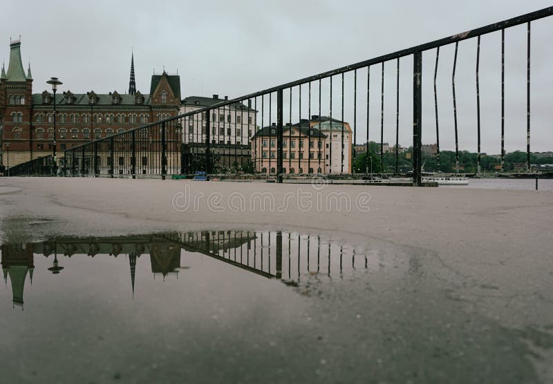 View of a Railing in Front of Buildings Stock Photo - Image of street ...