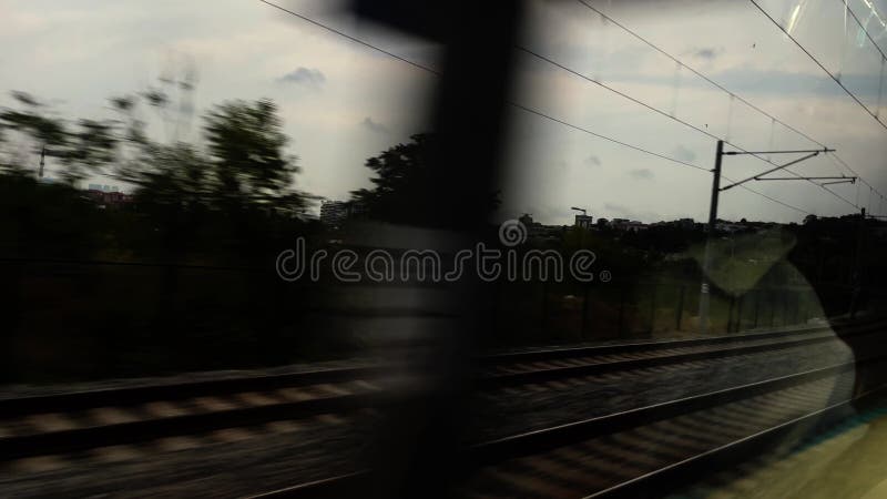 View of Railway Trails in Motion through Train Window in the Evening ...