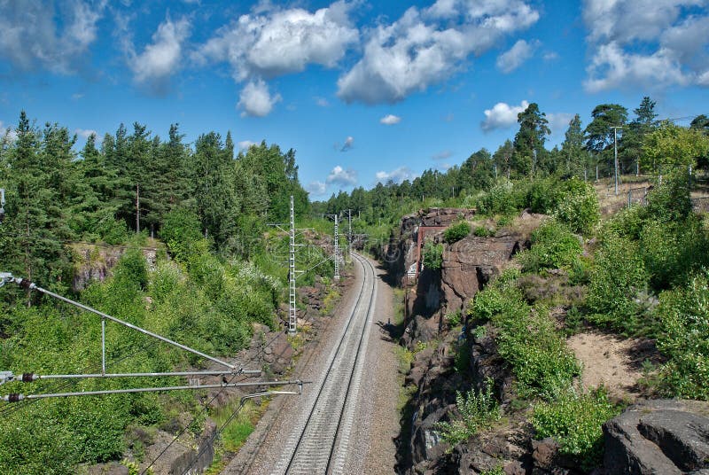 Railroad Tracks Passing through the Rocks Stock Photo - Image of ...