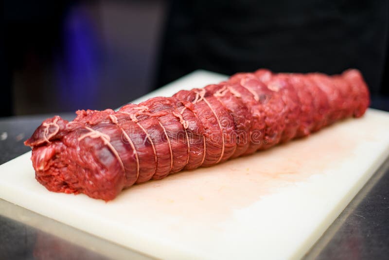 View on Raw Meatloaf on a White Cutting Board Stock Photo - Image of ...
