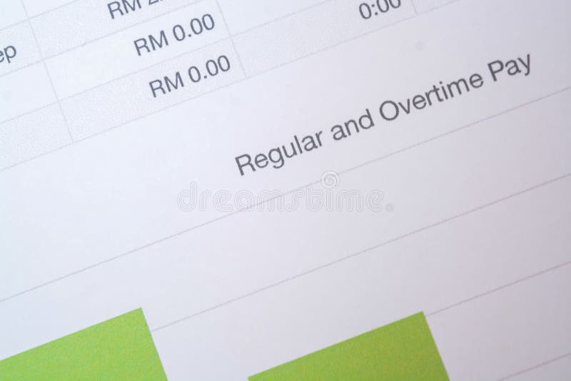 View of a Regular and Overtime Pay Sheet Paper, with a Concept of ...