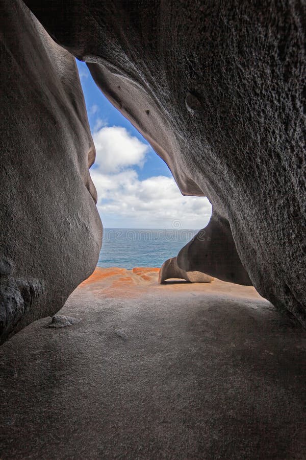 View through Remarkable Rock Formations Framing Blue Ocean Under a ...