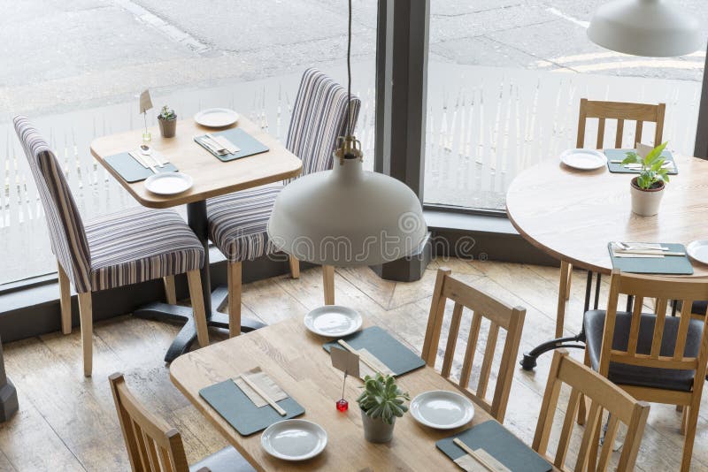 View of Restaurant Interior with Hanging Lamp in the Middle Stock Image ...
