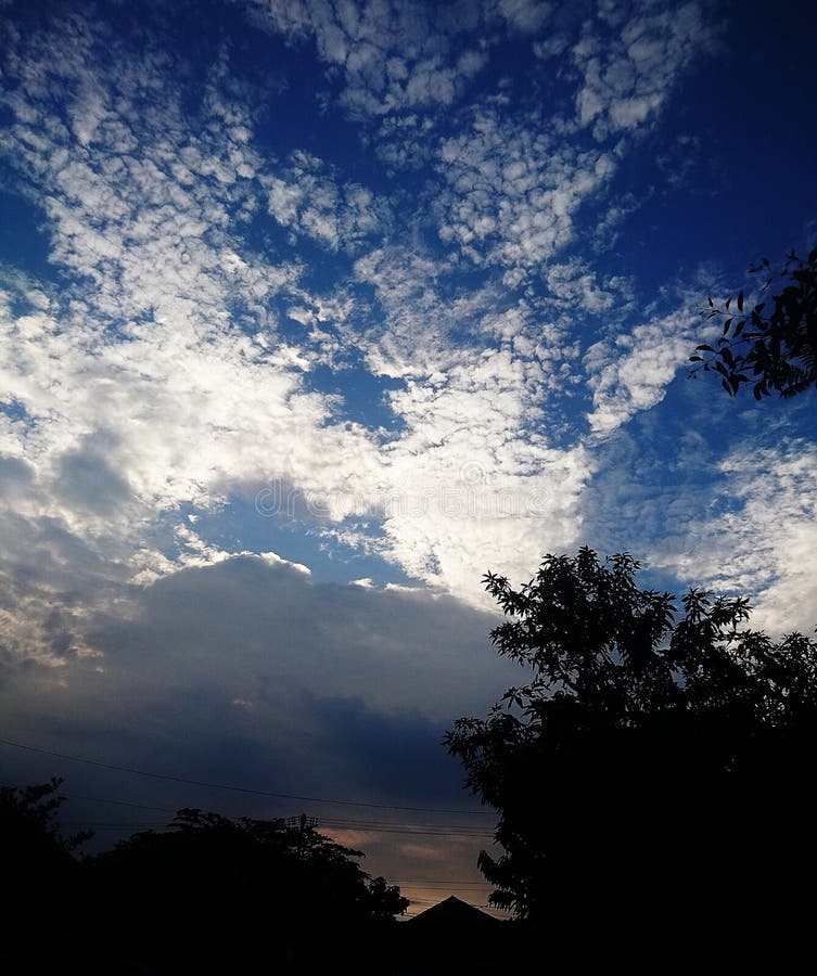 The View of the Rising Sun with Sky Full of Clouds Stock Photo - Image ...