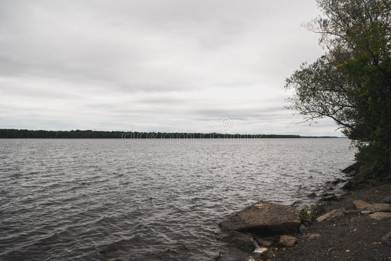 Moody day by the water stock photo. Image of orange - 126960242