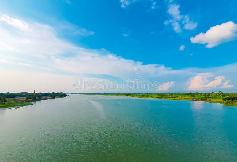 View of a River from the Bridge with White Clouds on the Sky in ...