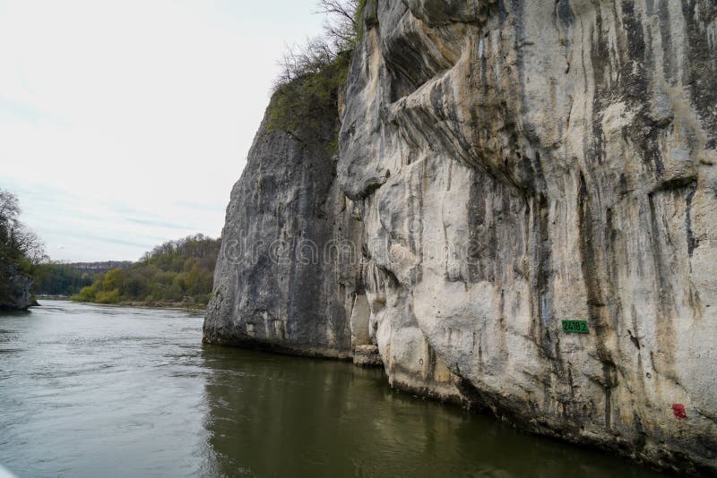 View of a River Flowing Next To Huge Cliffs Stock Photo - Image of ...