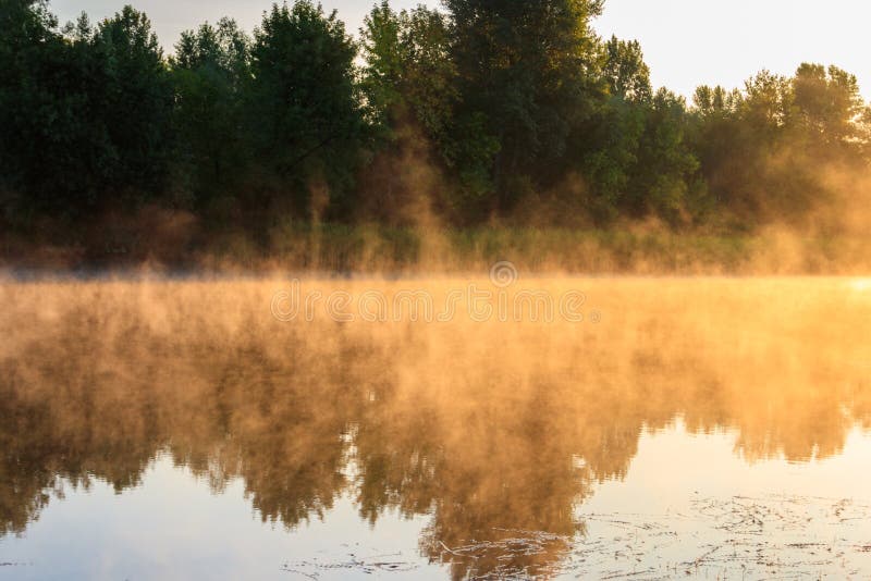 View of River in the Mist at Sunrise. Fog Over River at Morning Stock ...