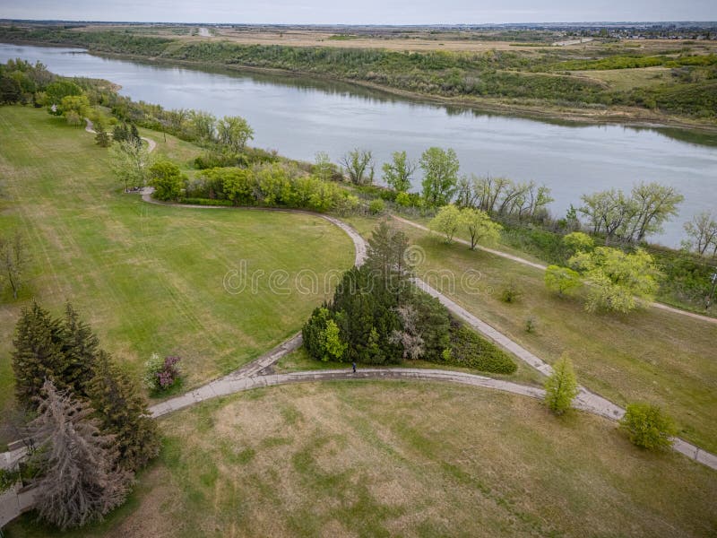View of a River and a Park with a Path Leading To a Small Pond Stock ...