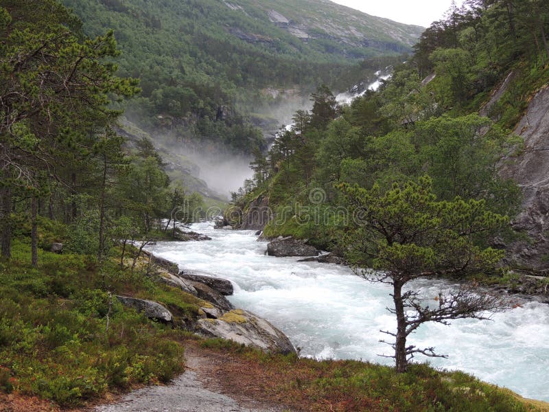 View of a River. Waterfall in the Back Stock Image - Image of road ...
