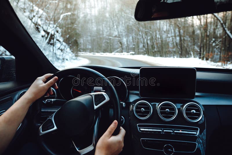 View of the Road, Drivers View. Man Driving on a Snowy Mountain Road ...